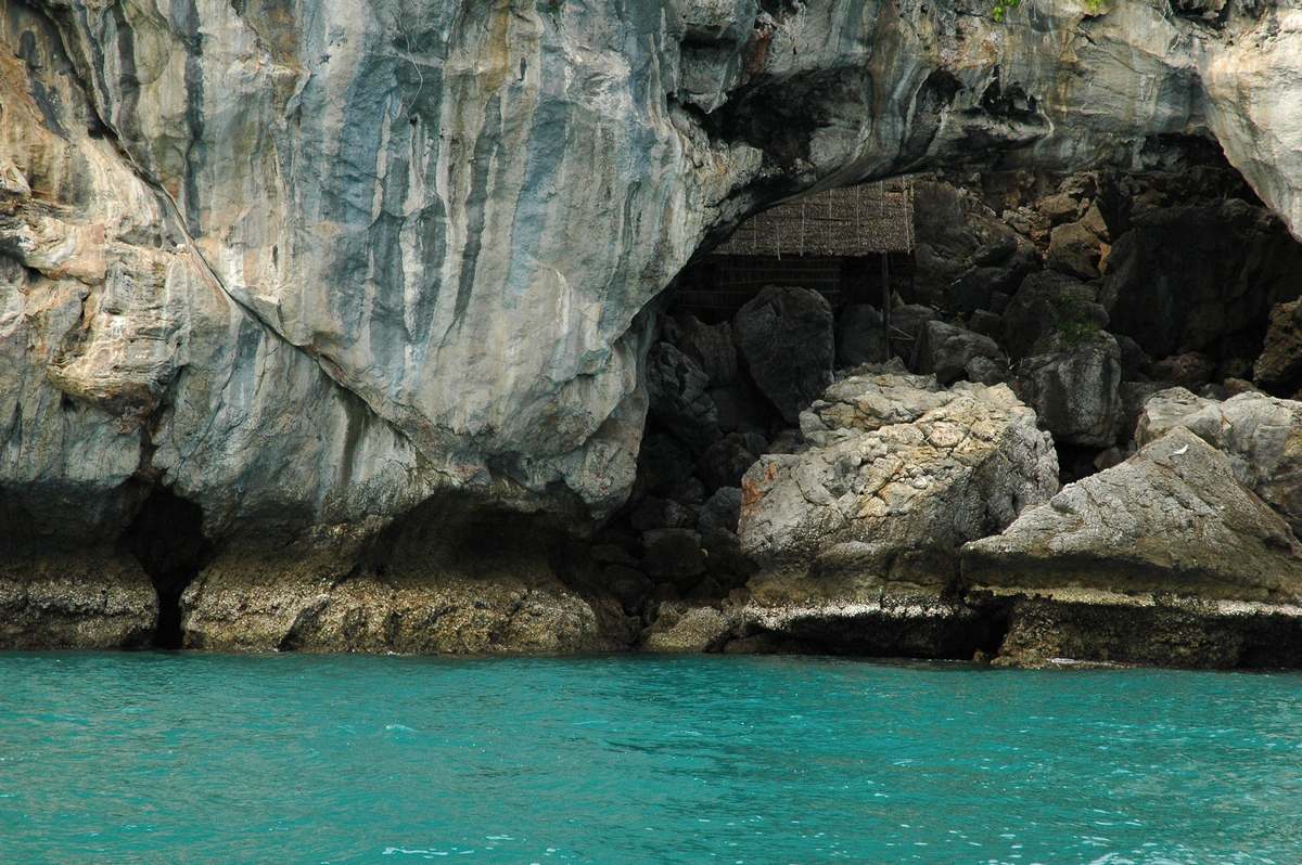 Deep green water with a hut.